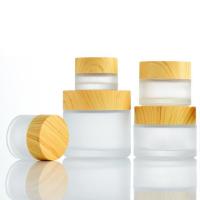 China Frosted Skincare Cosmetic Glass Bottles 15g 30g Glass Cream Jar With Bamboo Lid for sale