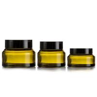 China 30g 50g Slant Shoulder Cosmetic Glass Jars Hot Stamping Glass Eye Cream Jar for sale