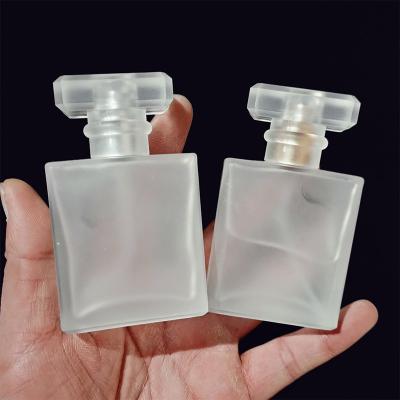 China 50ml Frosted Spray Square Glass Perfume Bottles With Silver Pump for sale