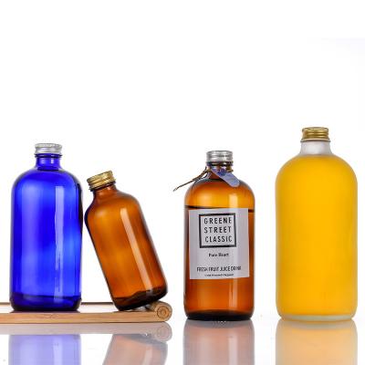 China Round Glass Drink Bottles 750ml 1000ml Empty Clear Boston Glass Bottles for sale