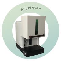 China Enclosed 20W 30W 50W Fiber Laser Marking Machine For Ring Glasswear for sale