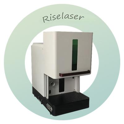 China Enclosed 20W 30W 50W Fiber Laser Marking Machine For Ring Glasswear for sale