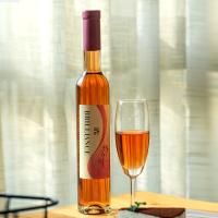 China 200ml 375ml 500ml 750ml 1000ml round glass liquor bottle with cork lid and custom design for sale