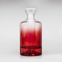 China Whisky 500ml Creative Design Glass Bottle With Red Volcanic Bump Bottom and Glass Cork for sale