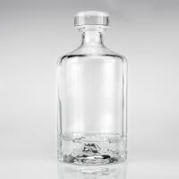 China Whisky 500ml Creative Design Glass Bottle With Red Volcanic Bump Bottom and Glass Cork for sale