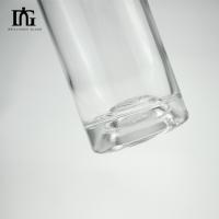 China Engraving Surface 700ml Round Shape Wide Mouth Glass Bottle for Clear Vodka Whisky for sale