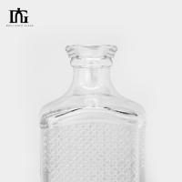 China Mineral Water Beverage 500ml 700ml 750ml Glass Bottle with Embossed Logo Square Design for sale