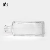 China Mineral Water Beverage 500ml 700ml 750ml Glass Bottle with Embossed Logo Square Design for sale