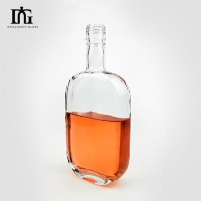 China 500ml Transparent Vodka Glass Bottle with Sealed Cork and Engraving Surface for sale