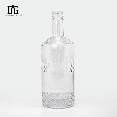China 700ml Capacity Engraving Glass Bottle for Gin Rum Brandy Whiskey Beverage Container for sale