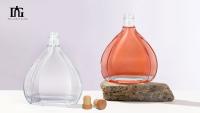 China Transparent Round 700ml 750ml Glass Vodka Whisky Rum Bottle with Screw Cap and Sample for sale