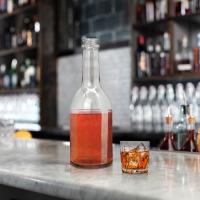 China Provided Freely Sample Acceptable OEM/ODM 750ml Glass Wine Bottle with Design and Cork Stopper for sale
