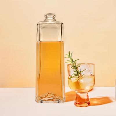 China Transparent Square Glass 500ml 750ml Whiskey Bottle with Cork and Engraving for sale
