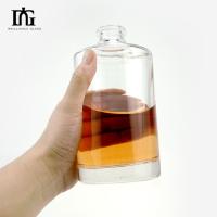 China Hot Stamping Engraving Frosted Whiskey Round Clear Glass Bottle 500ml 700ml 750ml for Soda for sale