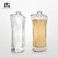 China Glass Beverage Bottle with Gold Cork Screw Cap Transparent Vodka Glass Bottle Beer for sale