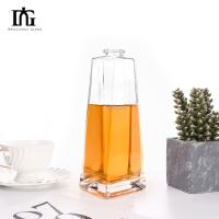 China Custom Made Unique Design 500ml Bottle Engraved Triangle Tequila Glass Bottle with Lid for sale