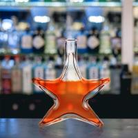 China Custom Stars Shaped Glass Bottles for Mineral Water 250ml/500ml/700ml/750ml Capacity for sale