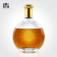 China Custom 700Ml Round Flint Glass Liquor Wine Whisky Vodka Tequila Bottle With Cork Lid for sale