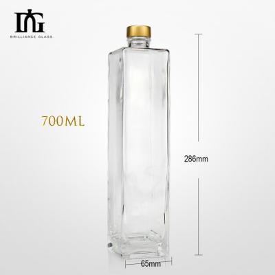 China Base Material Glass Bottle with Cork and Screw Cap 700ml Clear Empty Whisky Bottle for sale