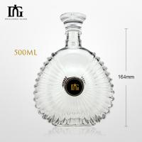 China 500ml Embossed Round Glass Bottle for Liquor Brandy Vodka Whisky Gin Rum Custom Design for sale