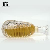 China 500ml Embossed Round Glass Bottle for Liquor Brandy Vodka Whisky Gin Rum Custom Design for sale