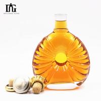 China 500ml Embossed Round Glass Bottle for Liquor Brandy Vodka Whisky Gin Rum Custom Design for sale