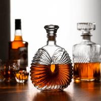China 500ml Embossed Round Glass Bottle for Liquor Brandy Vodka Whisky Gin Rum Custom Design for sale