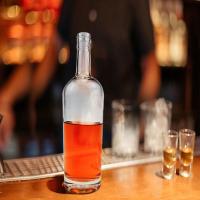 China 500ml Clear Flint Round Fruit Wine Glass Bottle with Screw Cap and Heat Transfer Printing for sale