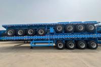 China 4 Axle Flatbed Semi Trailer with 80 Tons Load Capacity Mechanical Suspension for Versatile Transport Solutions for sale