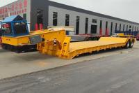 China 100-ton Payload Detachable Lowbed Semi Trailer with Reinforced Structure and Mechanical Loading Ladder for sale