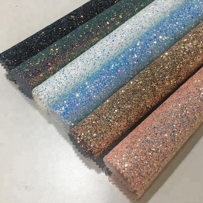China Waterproof Woven Backing chunky Glitter Faux Leather Fabric Black Glitter Fabric for sale