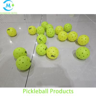 China SUNMORE Rotomolded Plastic Pickleball, Standard 40 Holes Outdoor Hard Pickle Ball For Training Competition Sports Entertainment for sale