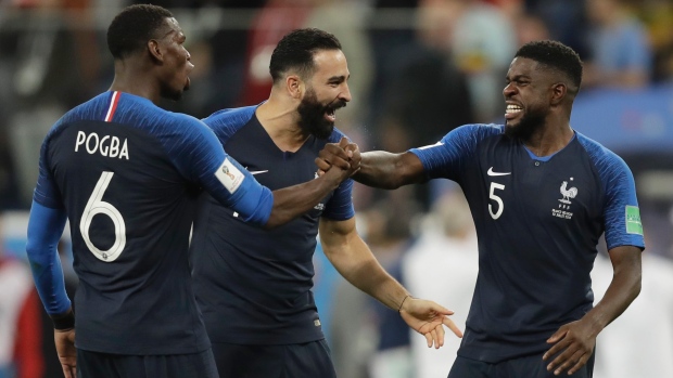 Samuel Umtiti Adil Rami Paul Pogba, The Canadian Press Samuel Umtiti Adil Rami Paul Pogba