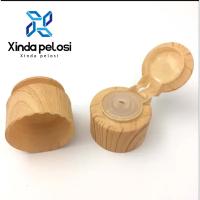 China 28mm Flip Top Plastic Bottle Caps Cosmetic Packaging Natural Bamboo Bottle Container Head for sale