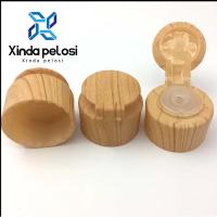 China 28mm Flip Top Plastic Bottle Caps Cosmetic Packaging Natural Bamboo Bottle Container Head for sale