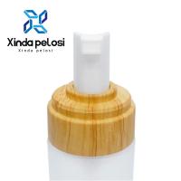 China Recyclable Biodegradable Cosmetic Container Packaging Glass Pump Bottle With Bamboo Lid for sale
