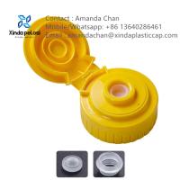 China PP Plastic Flip Top Cap With Silicone Valve For Squeeze Honey Condiment for sale