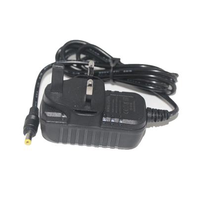 China UK Plug 5V 3A Power Supply Adapter with Multiple DC Outputs for sale