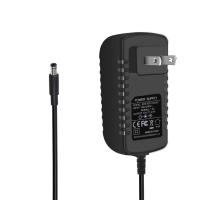 China 12V 1A Universal Travel Power Adapter AC to DC Converter with Interchangeable Plugs for sale