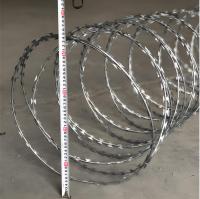 China CBT-65 Razor Barbed Wire Coil with 500mm Outer Diameter and 14 Gauge Core Wire for Border Protection for sale