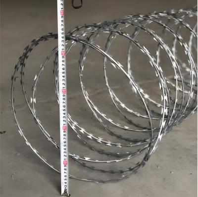 China CBT-65 Razor Barbed Wire Coil with 500mm Outer Diameter and 14 Gauge Core Wire for Border Protection for sale