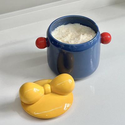 China Kitchen Ceramic Multi-Function Seasoning Jar with Filter Screen and Printing Design for sale