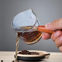 China 100ml Borosilicate Glass Coffee Measuring Cup with Double Spout Wooden Handle and Lid for sale