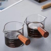 China 100ml Capacity Small Transparent Glass Coffee Cup with Lid and Double-Mouth Design for sale