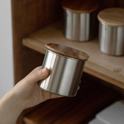 China Stylish Stainless Steel Coffee Storage Jar 11/12/13/14cm Customized Color Wooden Lid for sale