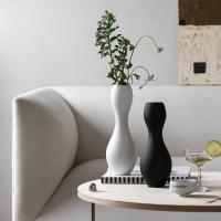 China Modern Minimalist Porcelain Vase with Elegant Black and White Bowling Ball Design for sale