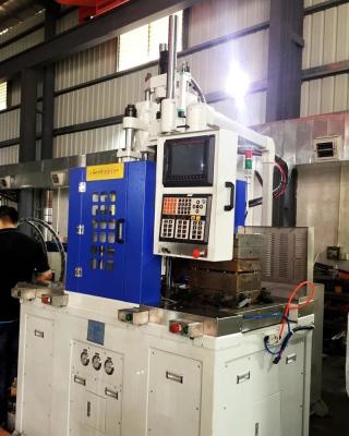 China Double Slide Table Vertical Injection Molding Machine for sale