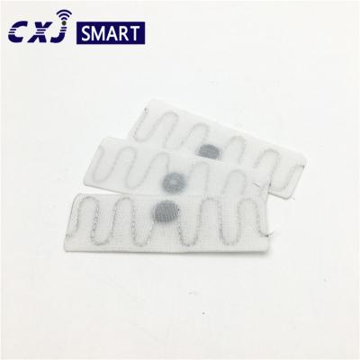 China Fabric Textile Heat Sealing Washable UHF RFID Laundry Tag for sale