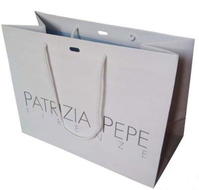 China Large White Kraft Paper Customized Paper Bags With Hole In The Center for sale