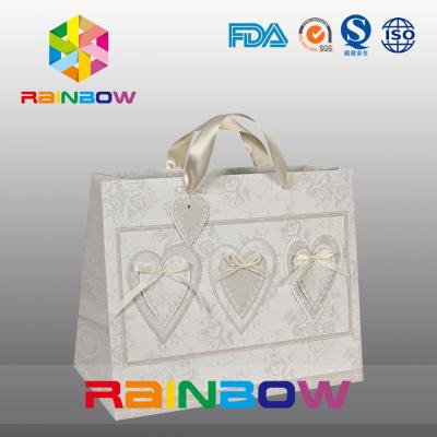 China Unique Design White / Red Custom Printed Paper Bags With Handle for sale